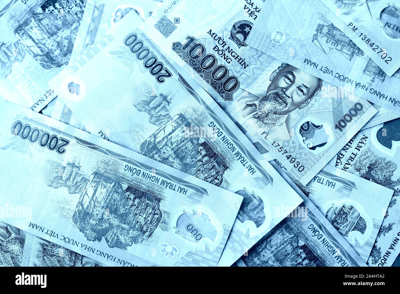 Vietnamese dong bills close up, blue color toned Stock Photo - Alamy