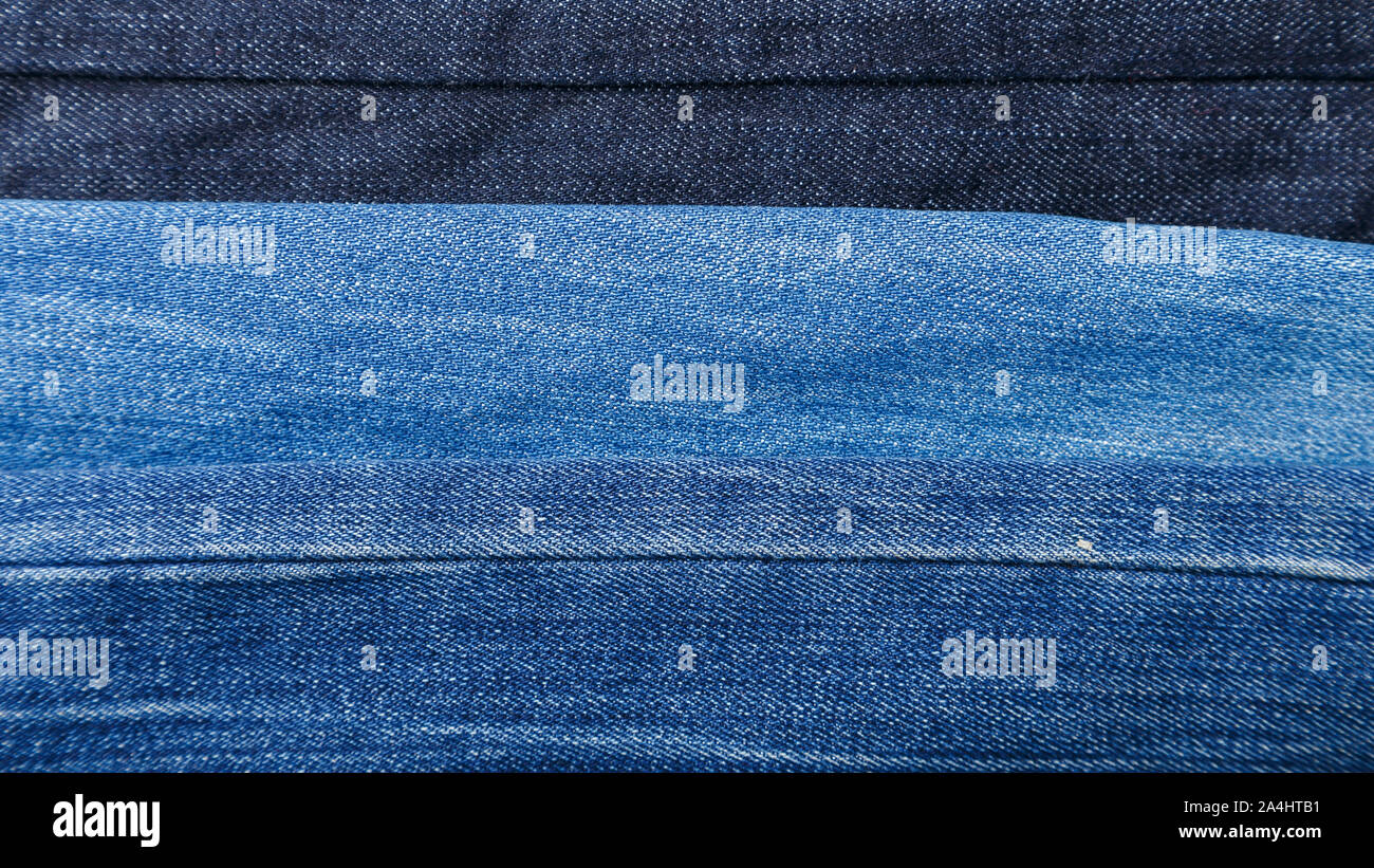 different jeans in color. fabric texture is clearly visible. place for ...