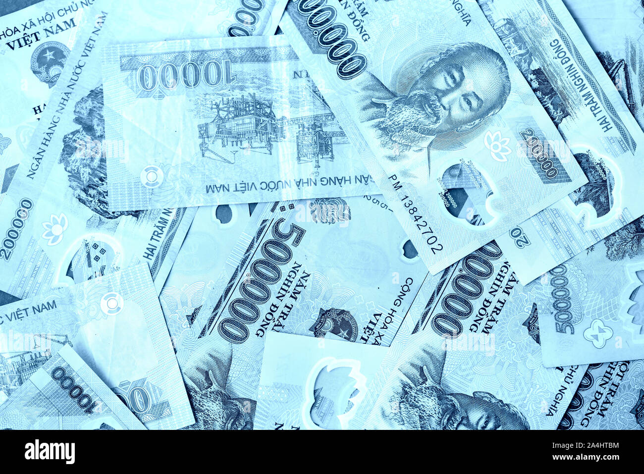 Vietnamese dong bills close up, blue color toned Stock Photo - Alamy