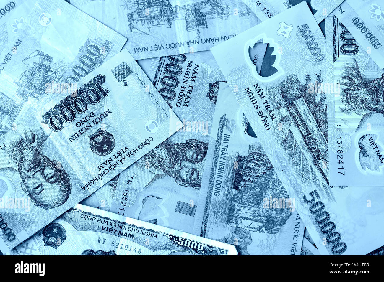 Vietnamese dong bills close up, blue color toned Stock Photo - Alamy
