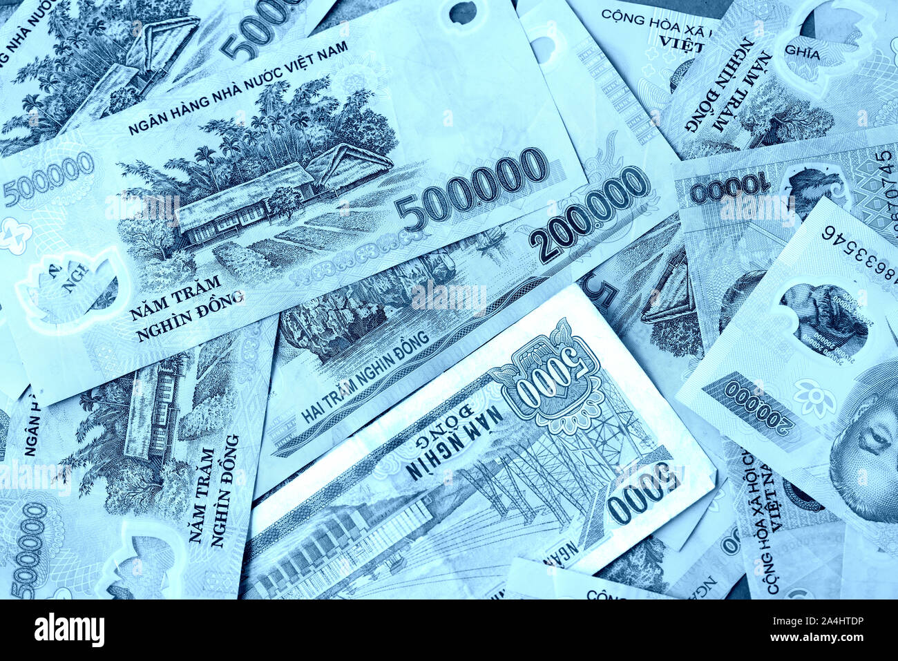 Vietnamese dong bills close up, blue color toned Stock Photo - Alamy