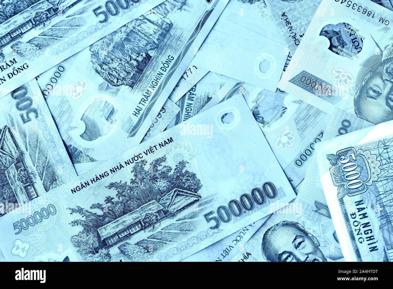 Vietnamese dong bills close up, blue color toned Stock Photo - Alamy