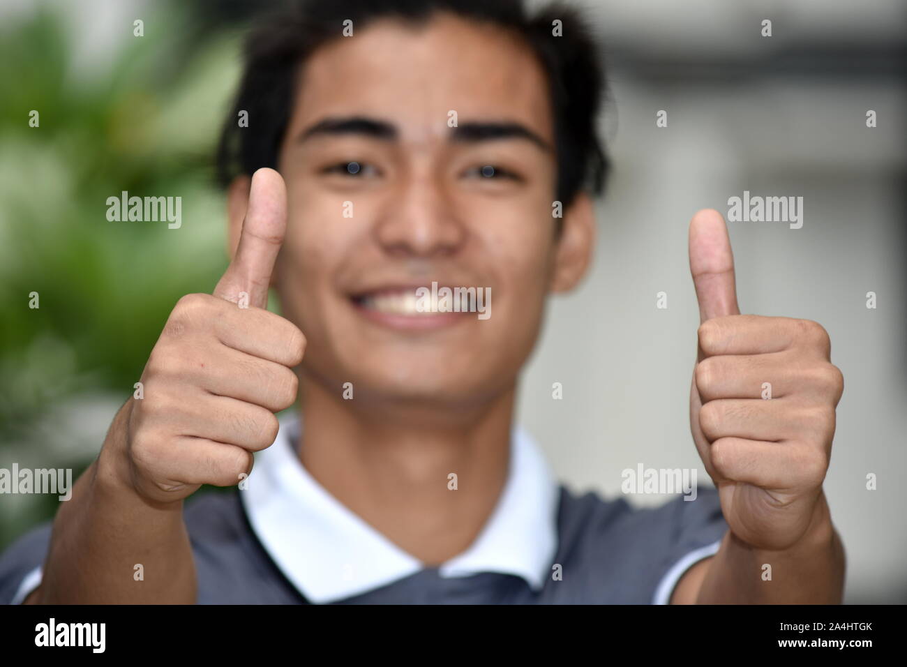 Young Minority Man With Thumbs Up Stock Photo - Alamy