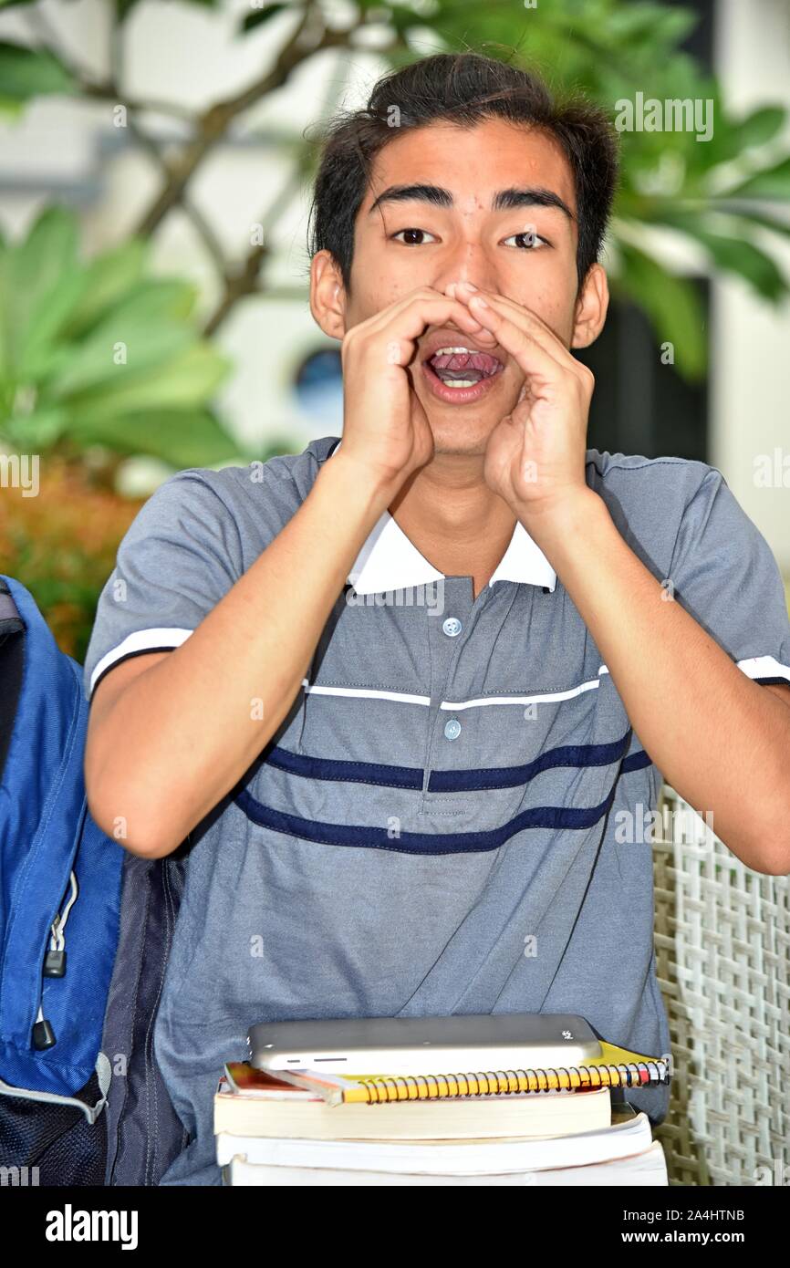 Boy Student Shouting With Books Stock Photo - Alamy