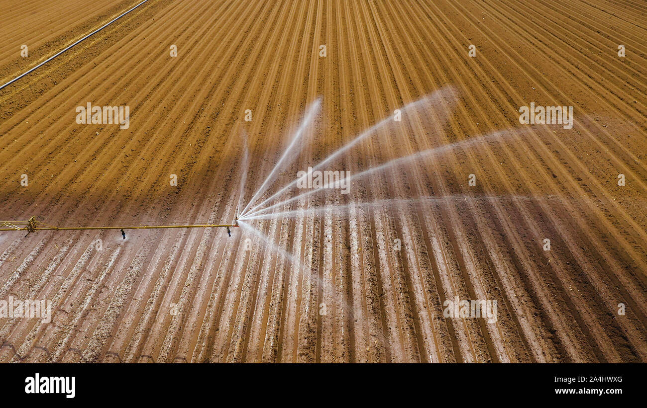 aerial view Center pivot agriculture irrigation machine of crops. An ...