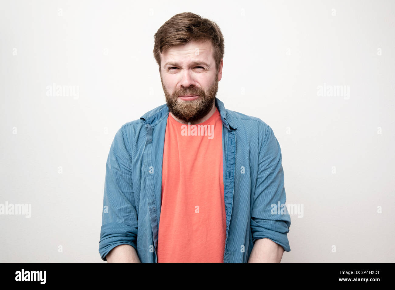 Funny facial expression of a resentful man who is about to cry ...