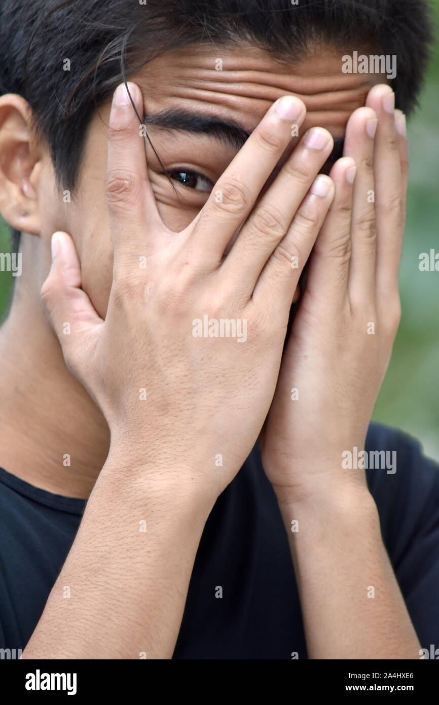Minority Man And Fear Stock Photo - Alamy