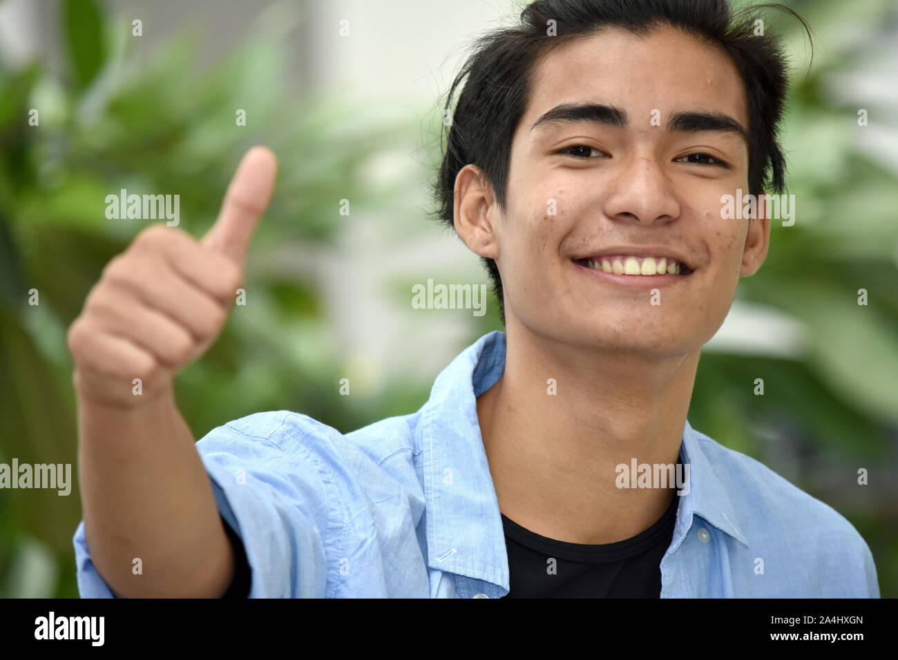 Filipino Male With Thumbs Up Stock Photo - Alamy