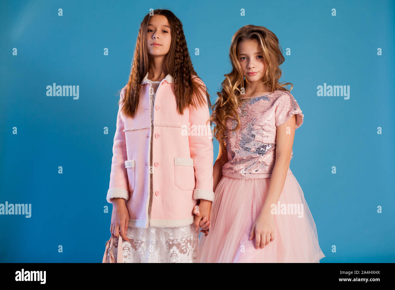 Two fashionable girls school girlfriends in white pink dresses Stock ...