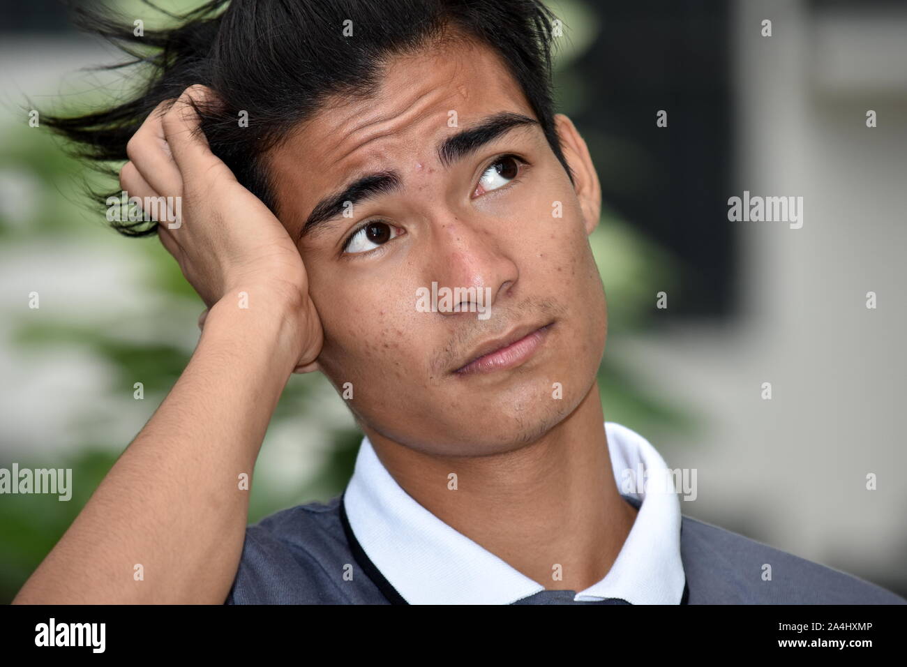 Young Filipino Person Wondering Stock Photo - Alamy