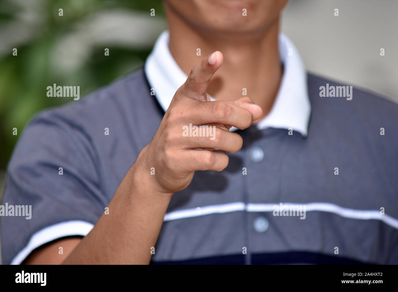 Handsome Filipino Male Pointing Stock Photo - Alamy