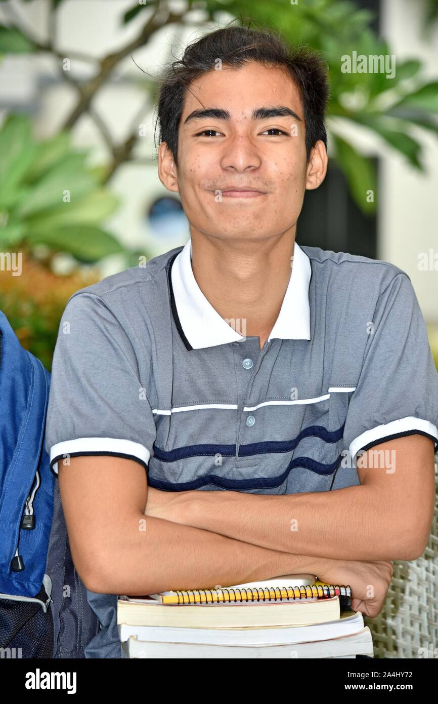 Stubborn Handsome Diverse Person With Books Stock Photo - Alamy