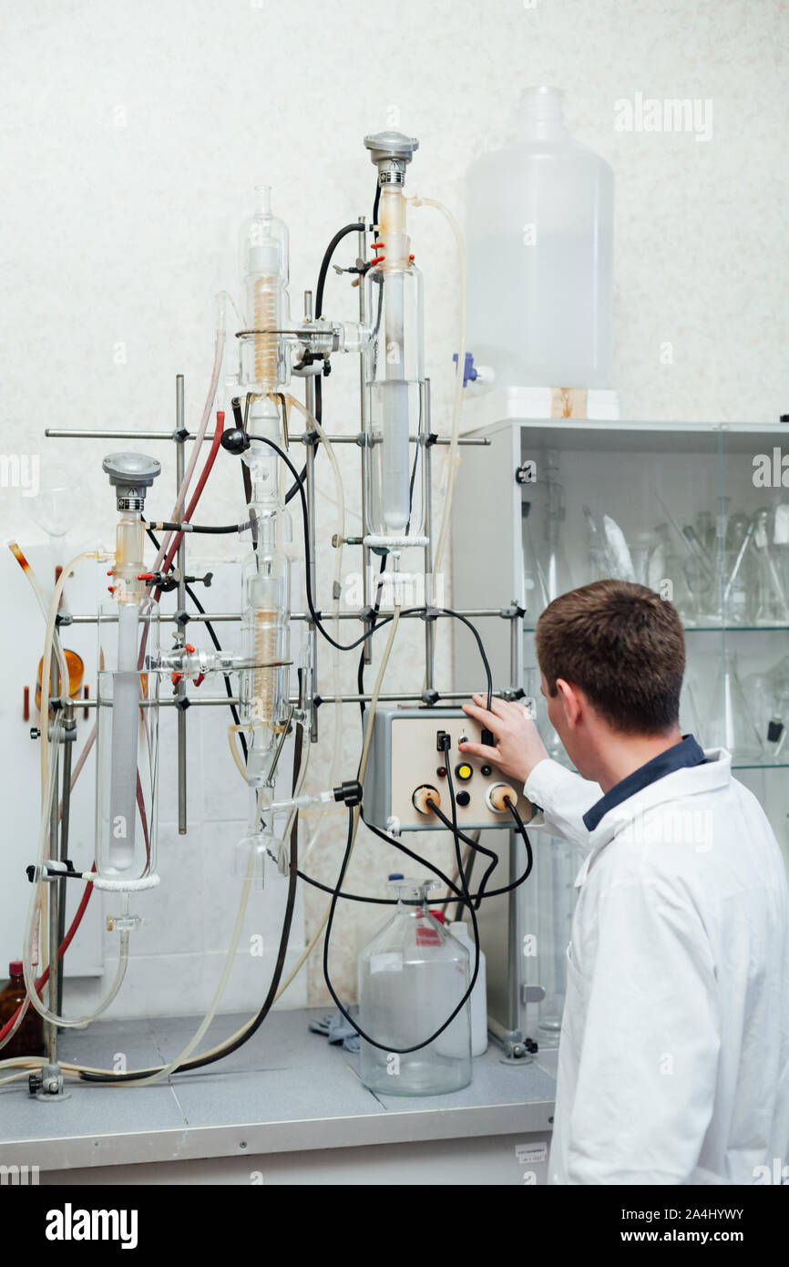 scientist conducts chemical experiments with liquids in the medical ...