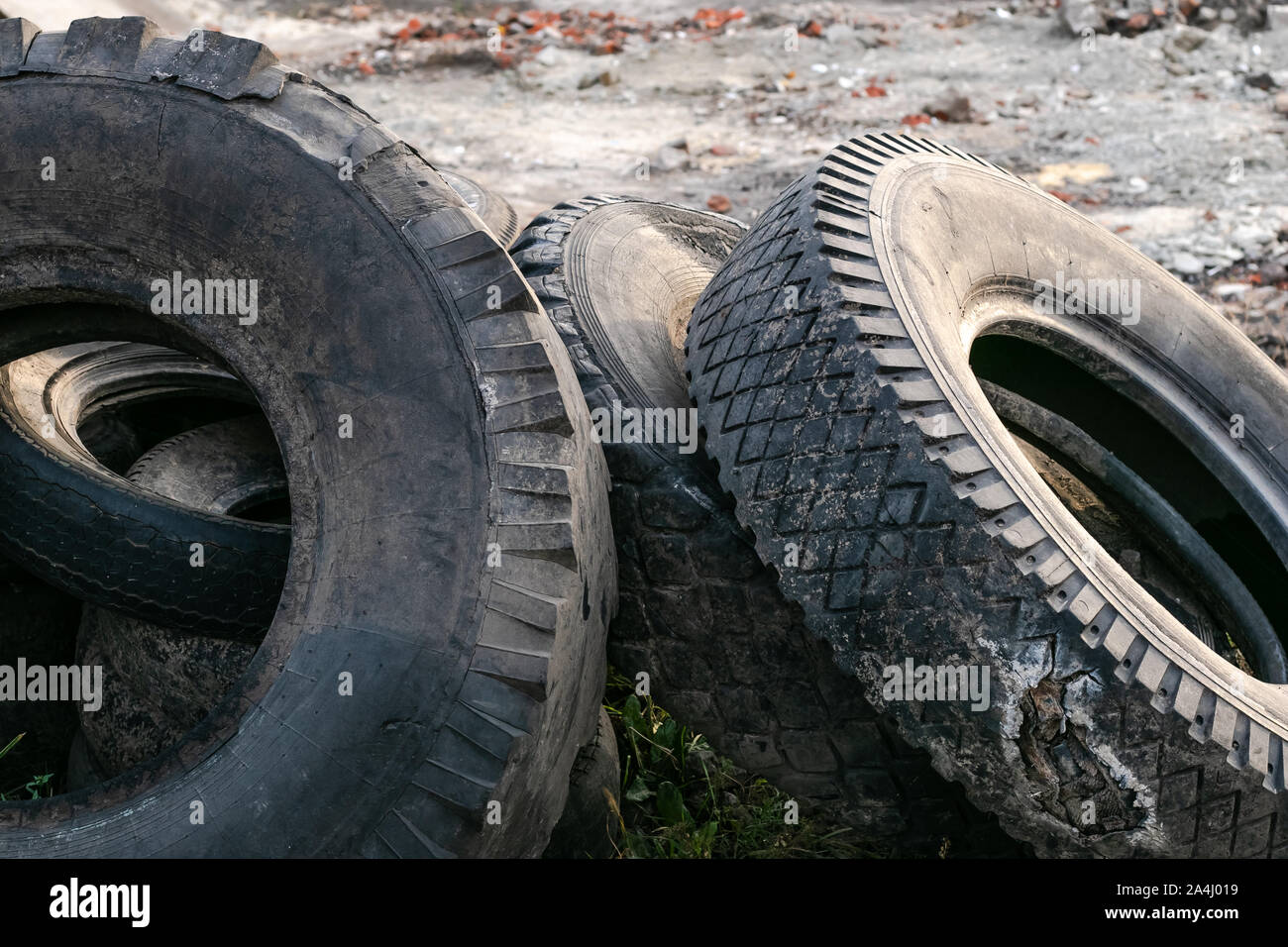 Heap of perforated car tires. Pile of old wheels. Dirty tire. Black ...