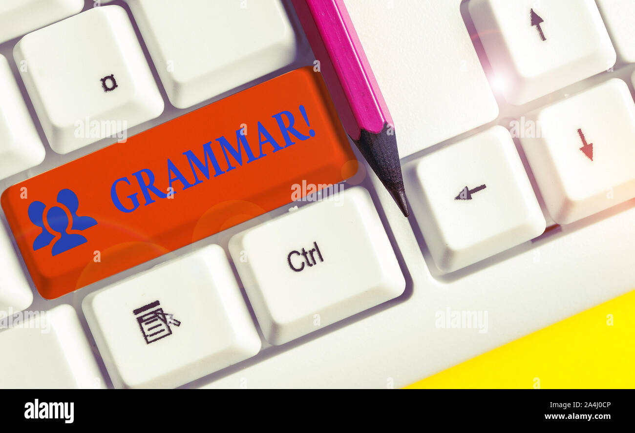 Writing note showing Grammar. Business concept for whole system ...