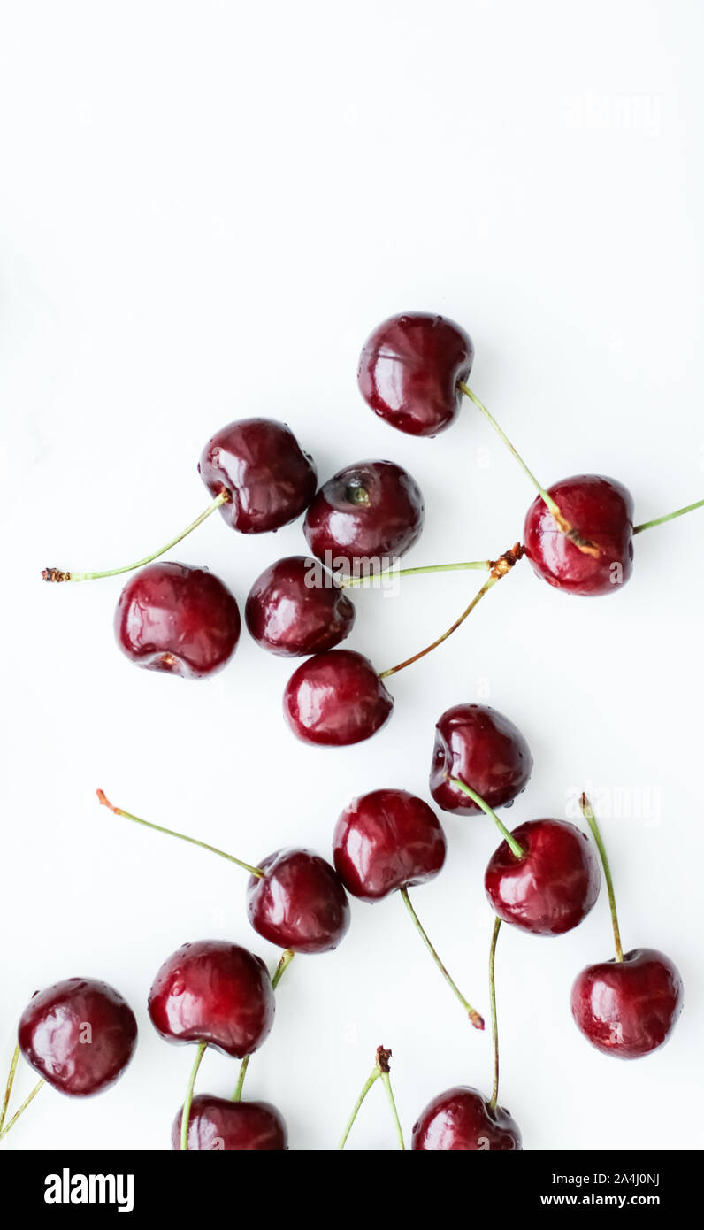 Organic food, vegan dieting and health concept - Fresh sweet cherries ...