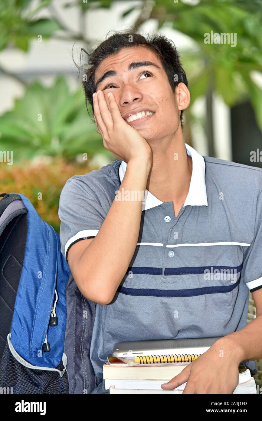 Asian Boy Student Wondering With Books Stock Photo - Alamy