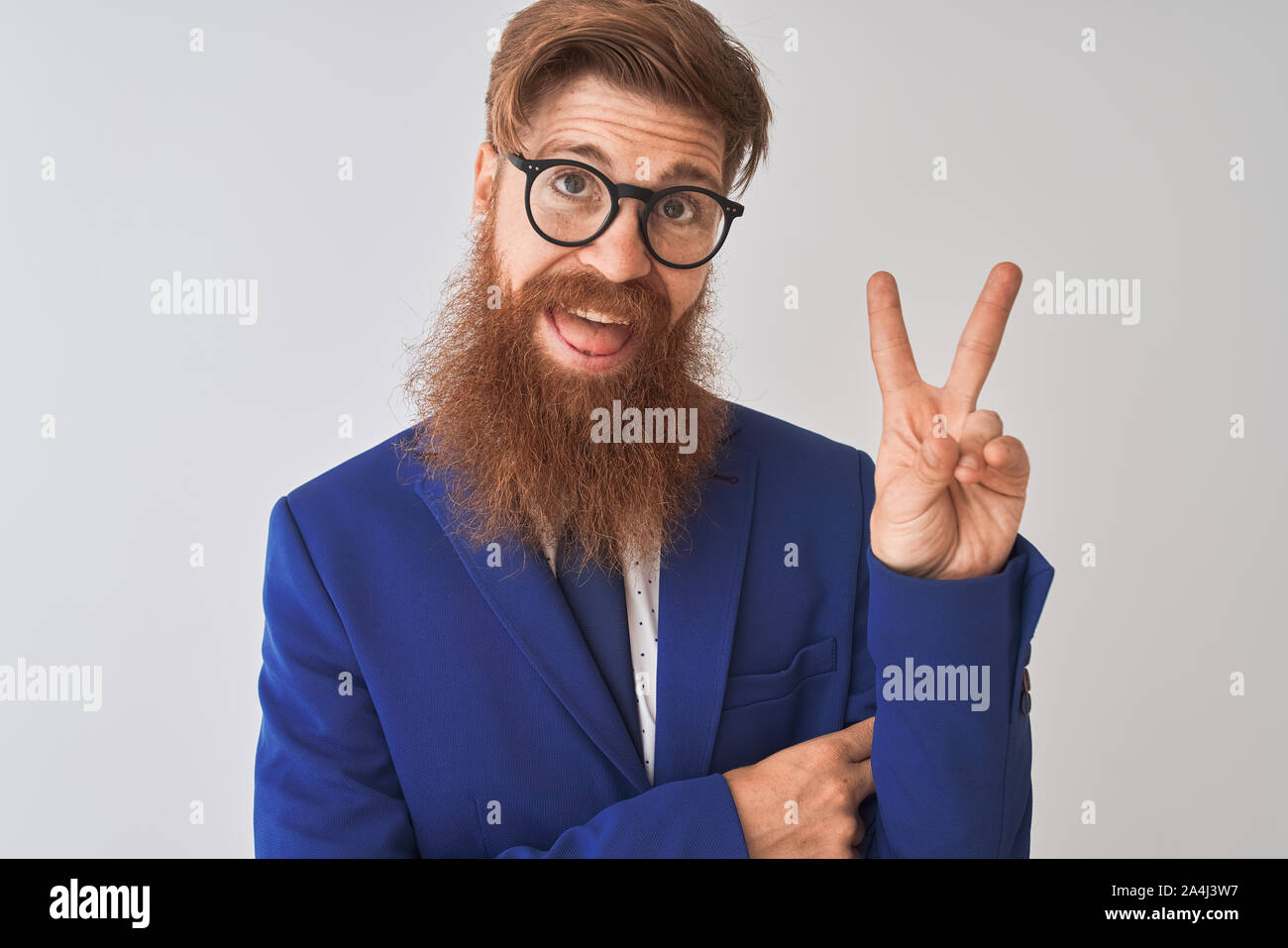 Young redhead irish businessman wearing suit and glasses over isolated ...
