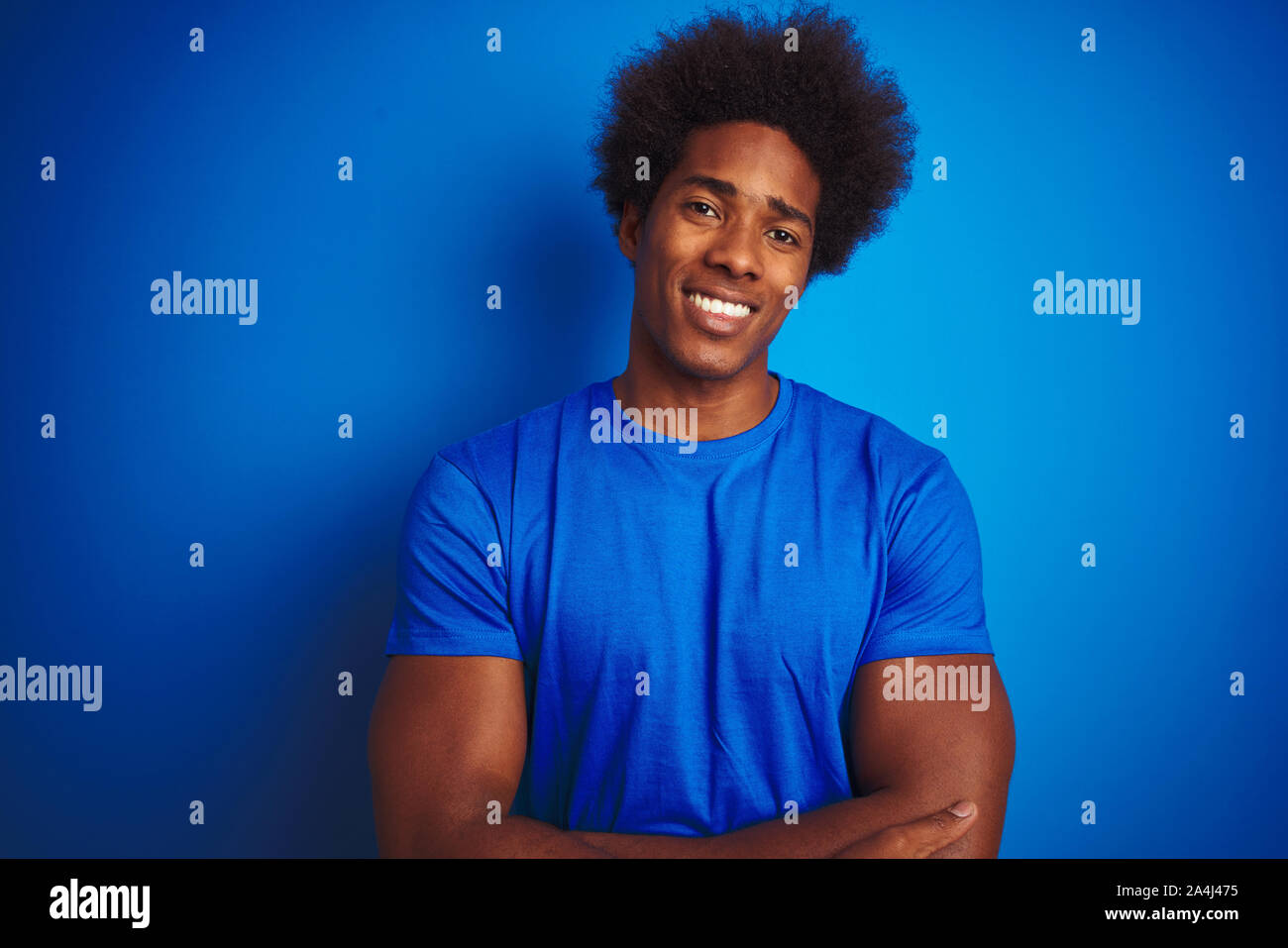 African american man with afro hair wearing t-shirt standing over ...
