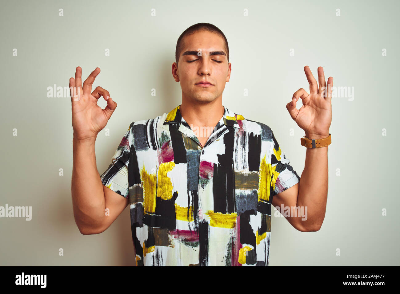 Young handsome man wearing summer shirt over white isolated background ...