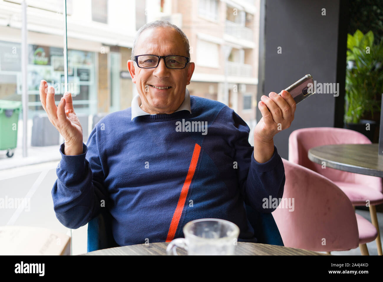 Handsome middle age senior man drinking coffee at restaurante, smiling ...