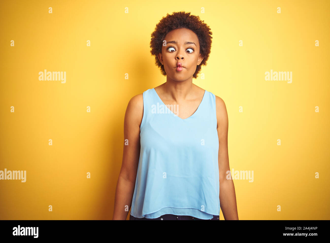 Beautiful african american woman wearing elegant shirt over isolated ...