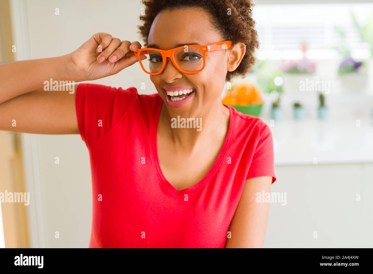 Beautiful young african woman with afro hair wearing glasses Stock ...
