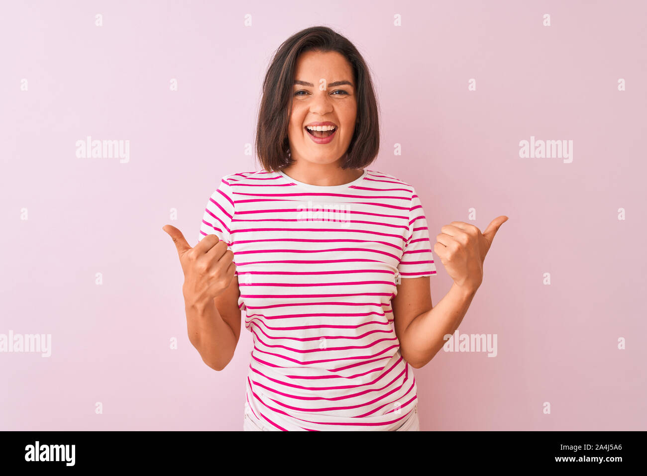 Young Beautiful Woman Wearing Striped T Shirt Standing Over Isolated