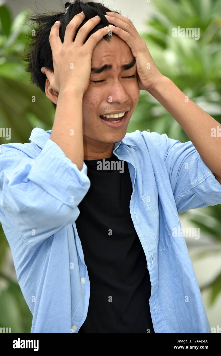 An Anxious Young Minority Person Stock Photo - Alamy