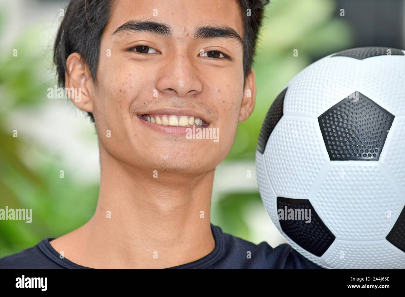 Young Filipino Male Soccer Player Smiling Stock Photo - Alamy