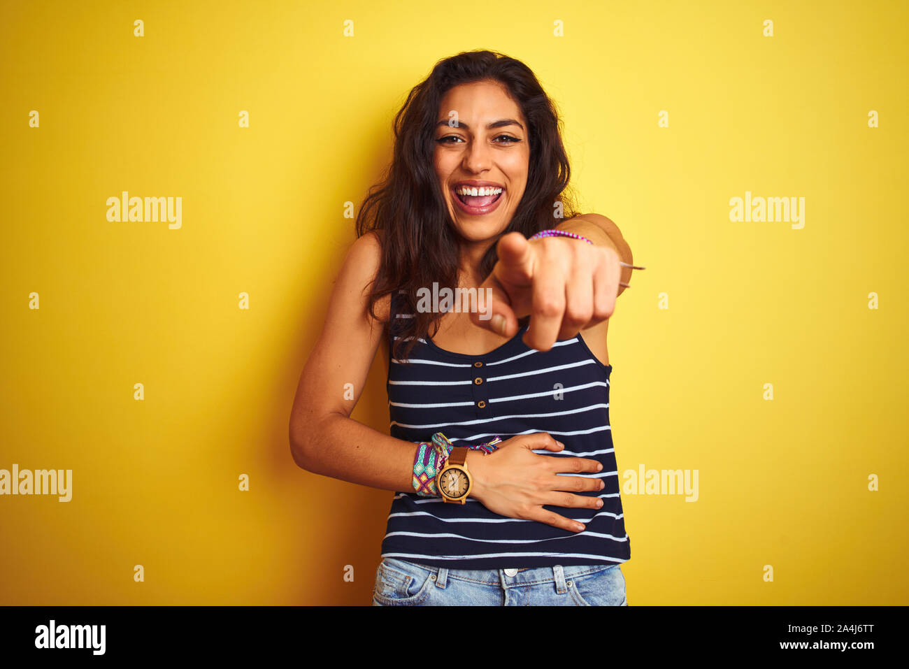 Young beautiful woman wearing striped t-shirt standing over isolated ...