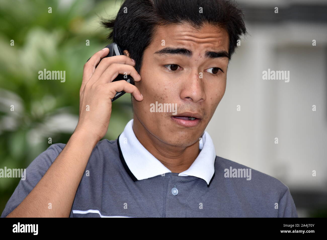 Man Using Cell Phone And Unhappy Stock Photo - Alamy