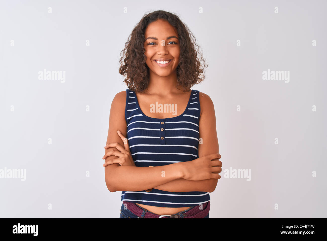 Young brazilian woman wearing striped t-shirt standing over isolated ...