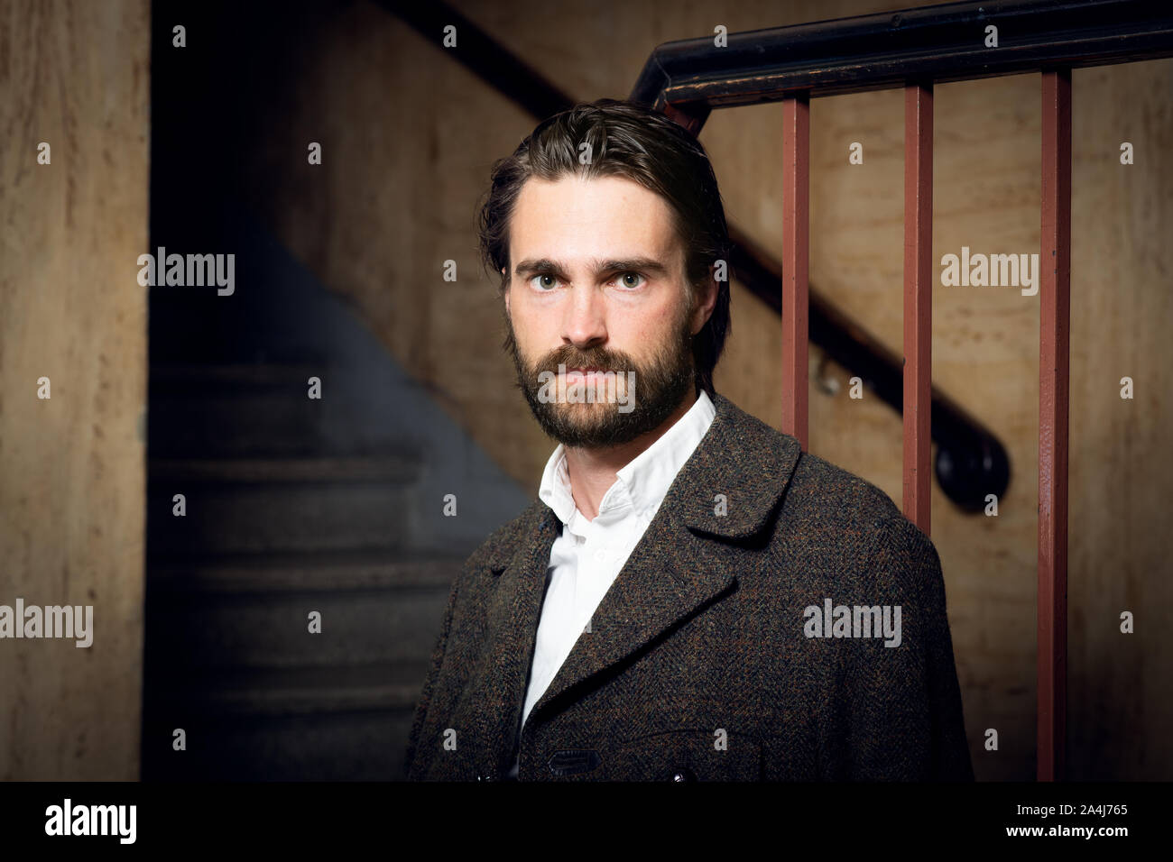 Young hipster man in coat hi-res stock photography and images - Alamy