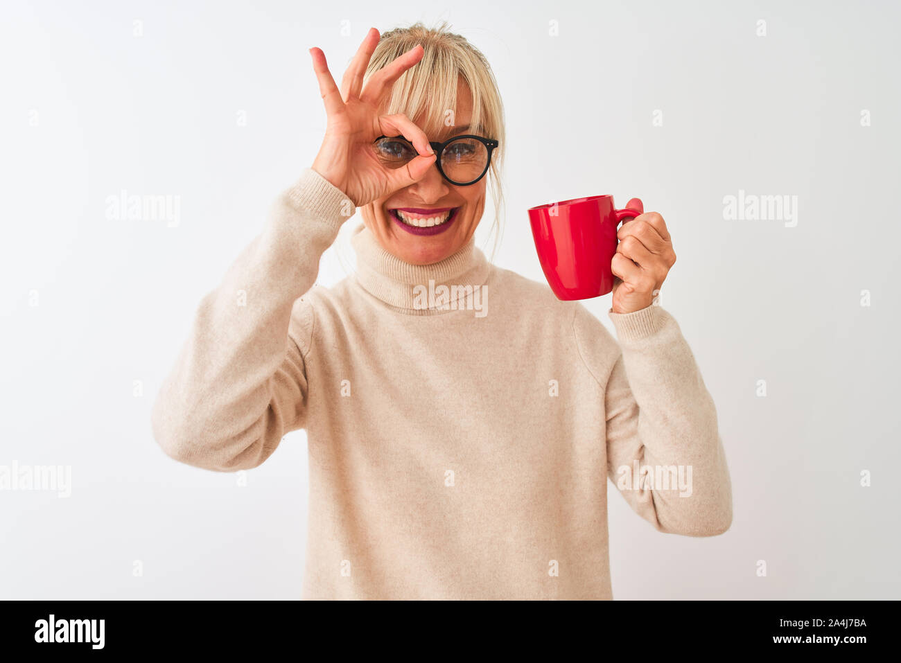 Middle age woman wearing glasses drinking red cup of coffee over ...