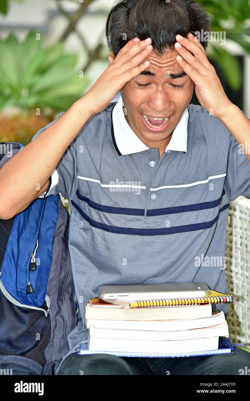 Stressed Male Student Stock Photo - Alamy