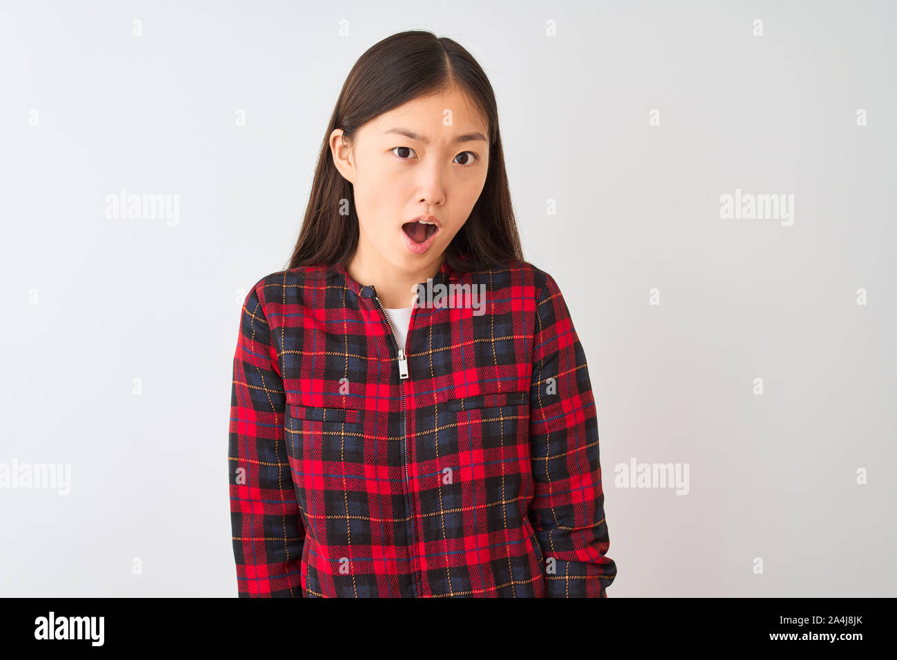 Young chinese woman wearing casual jacket standing over isolated white ...