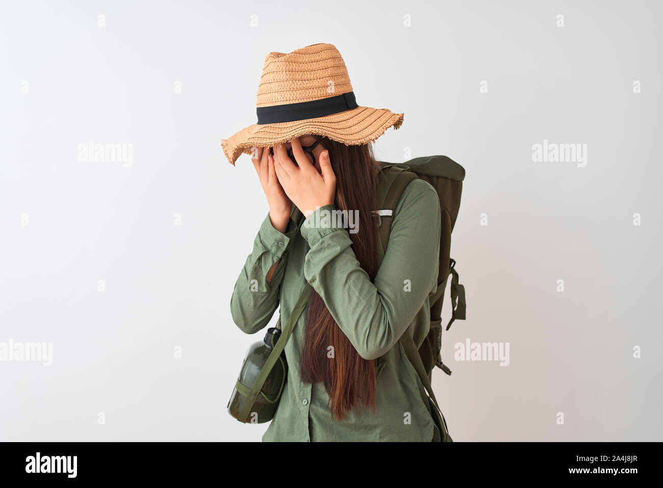 Chinese hiker woman wearing canteen hat glasses backpack over isolated ...