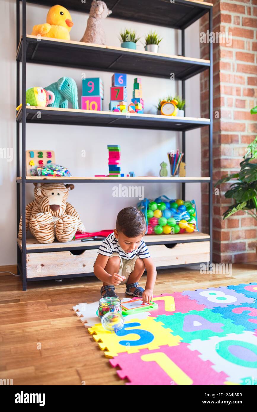 Beautiful toddler boy drawing cute draw using digital board at ...