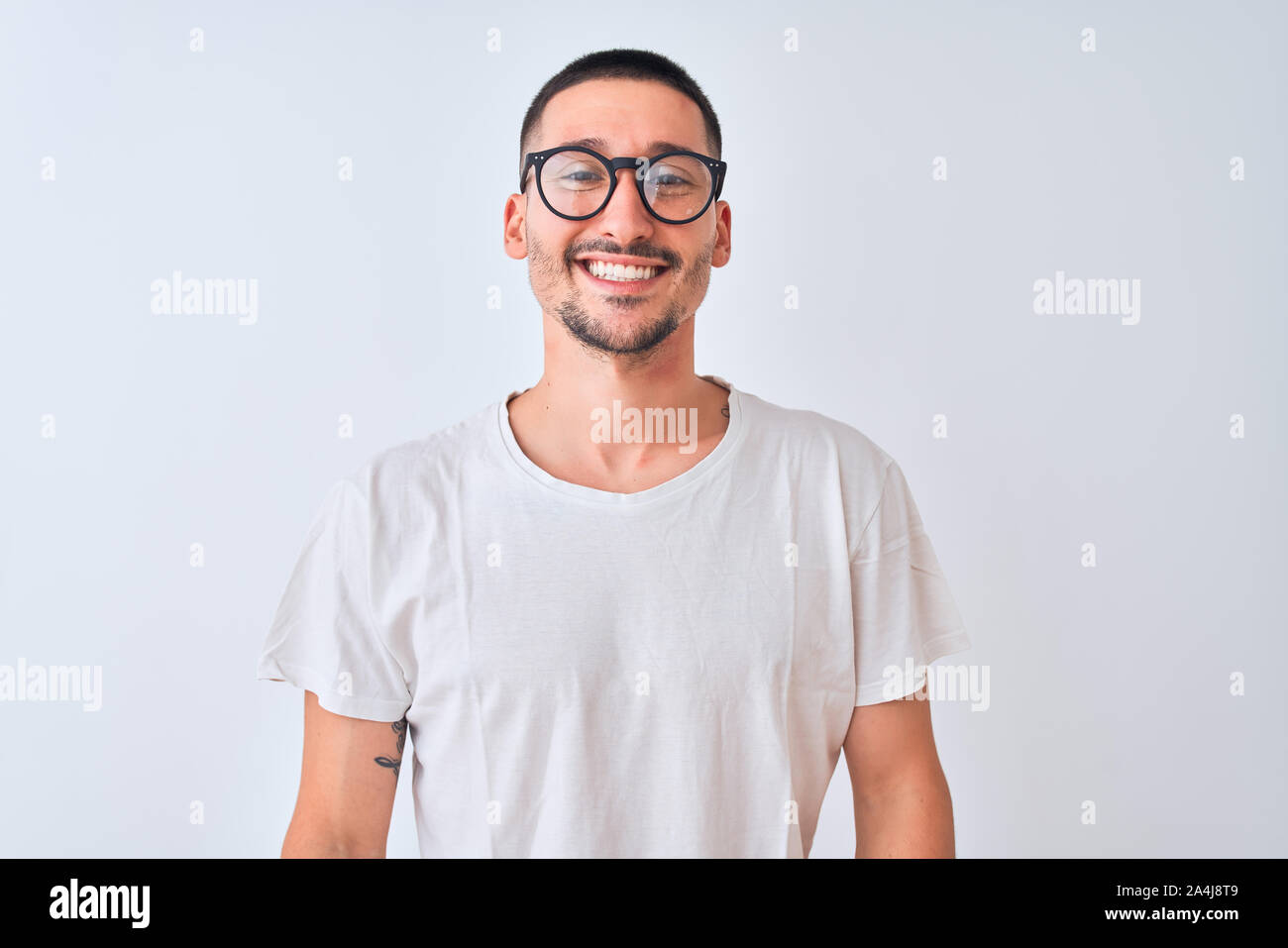 Young handsome man wearing glasses and standing over isolated ...