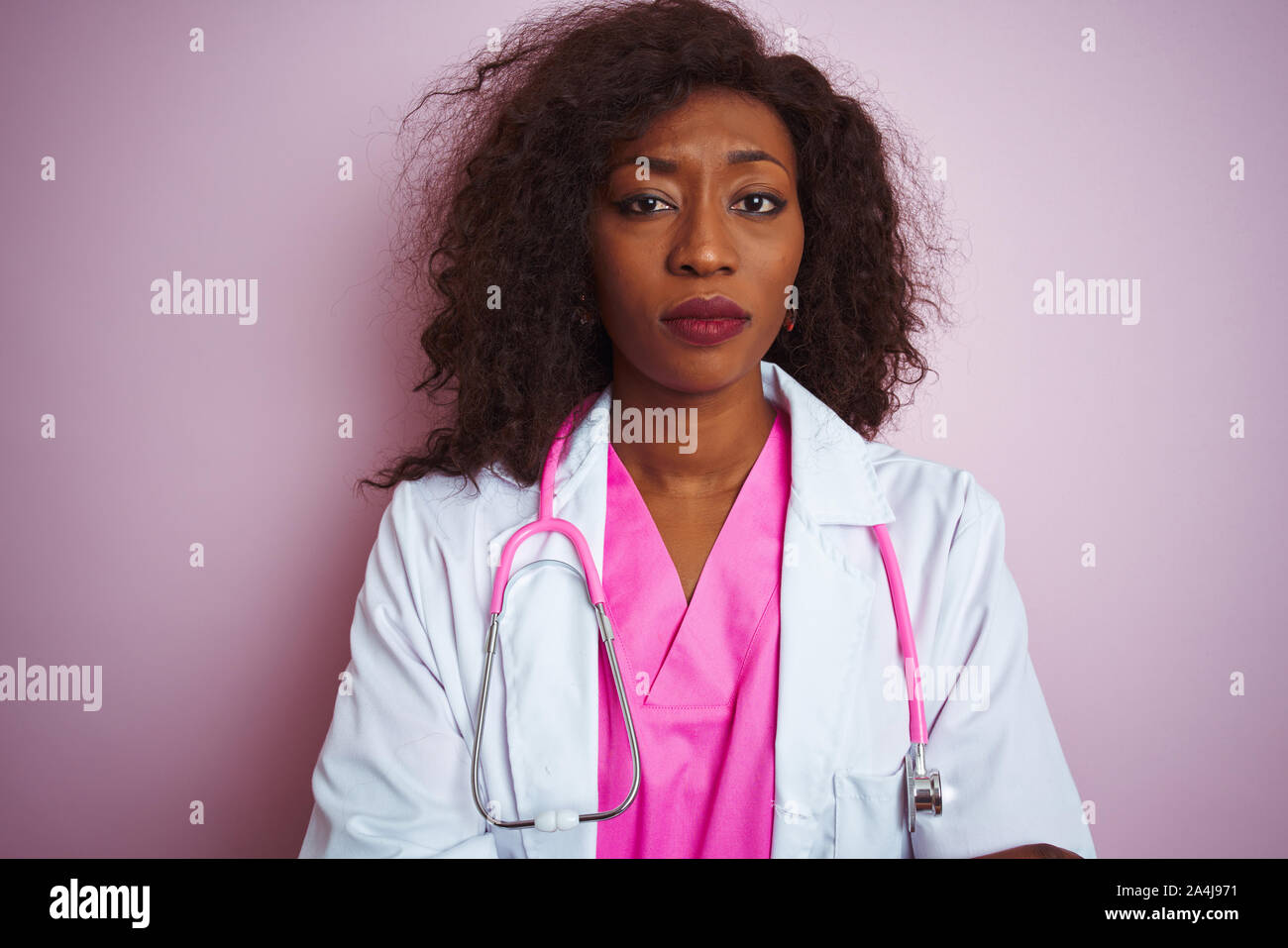 African american doctor woman wearing stethoscope over isolated pink ...