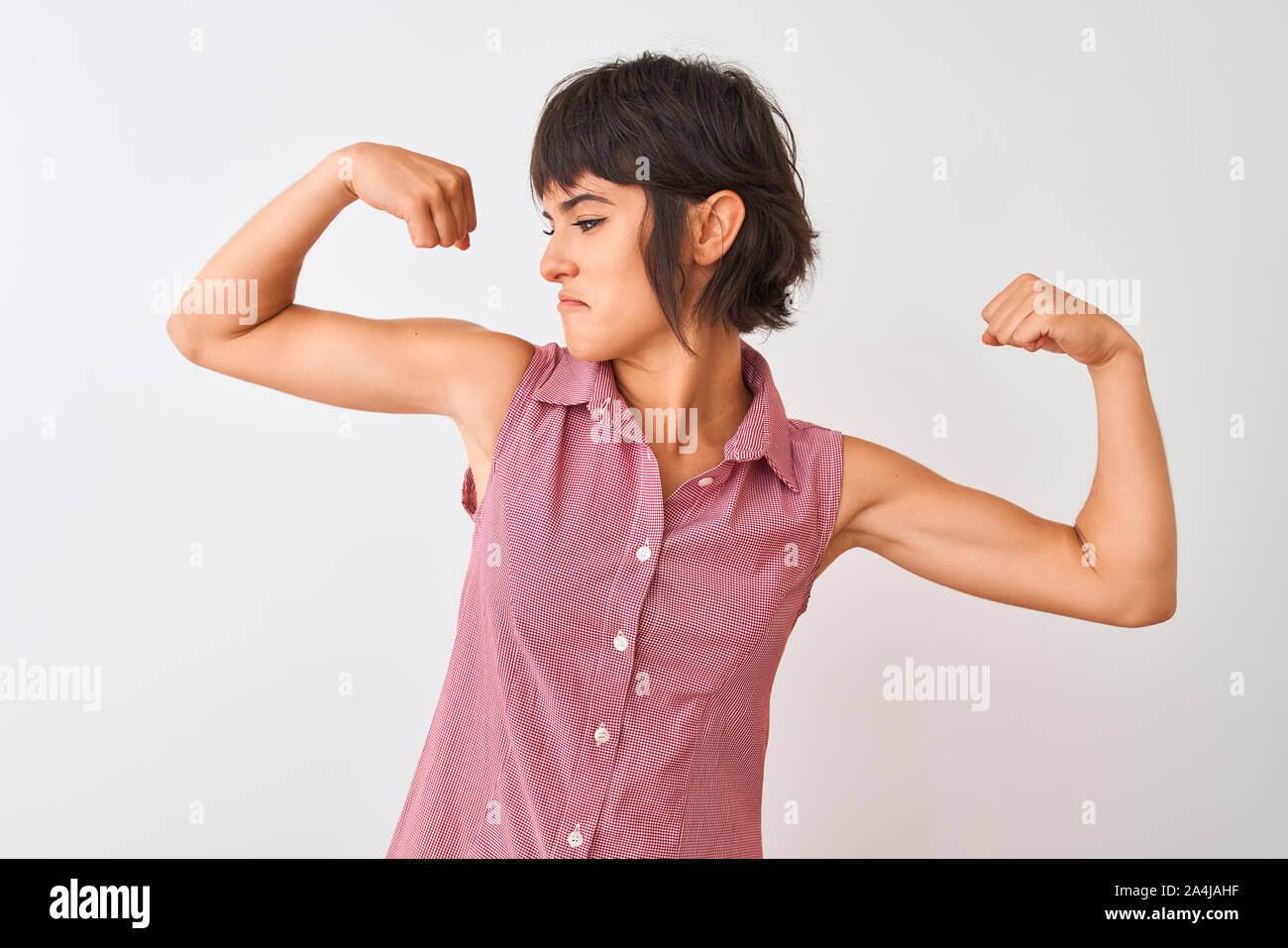 Young beautiful woman wearing red summer shirt standing over isolated ...