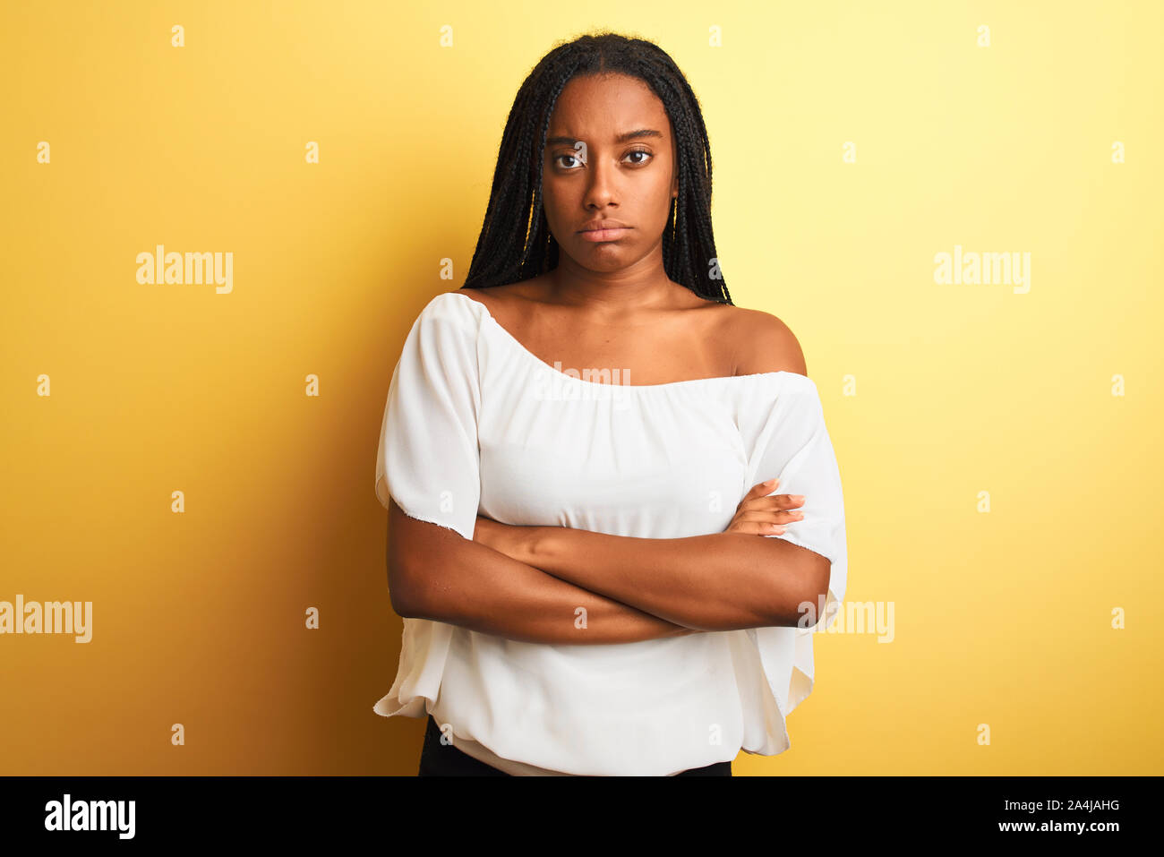 Young african american woman wearing white t-shirt standing over ...