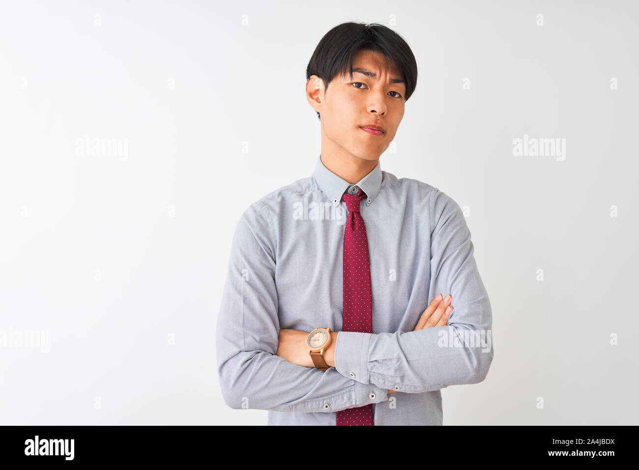 Chinese businessman wearing elegant tie standing over isolated white ...