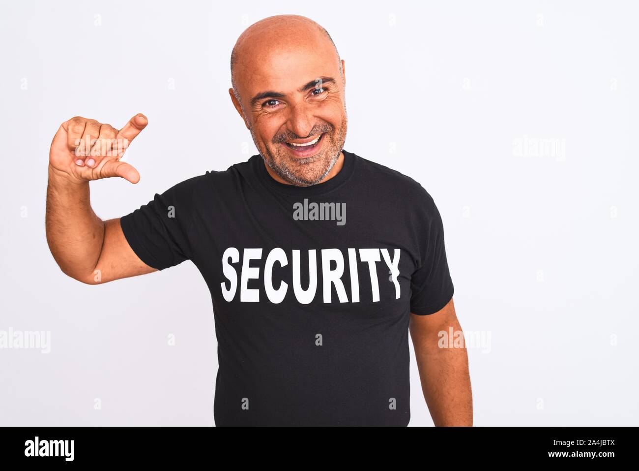 Middle age safeguard man wearing security uniform standing over ...