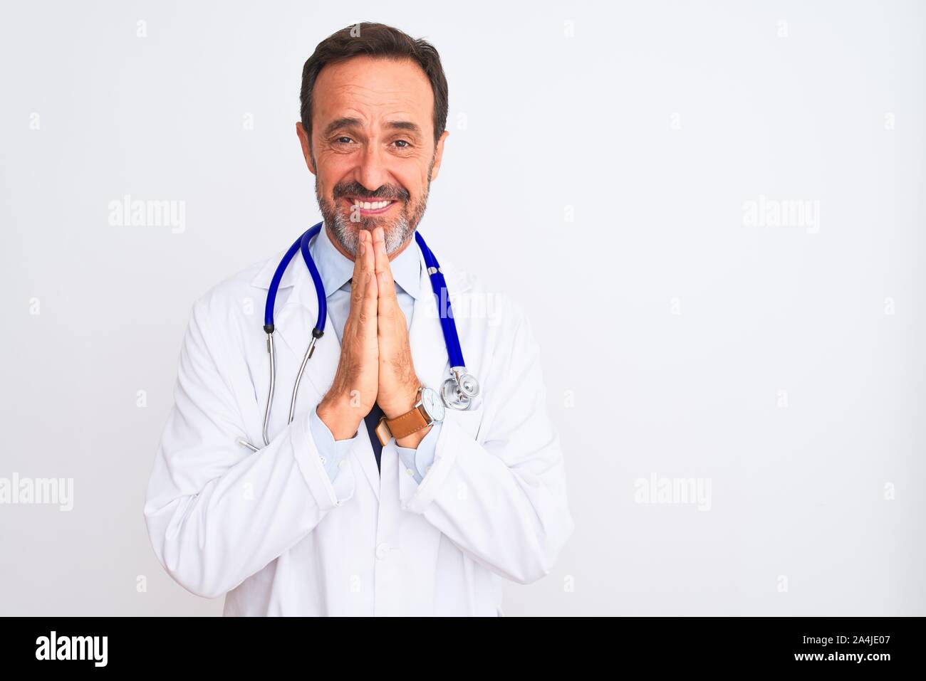 Middle age doctor man wearing coat and stethoscope standing over ...