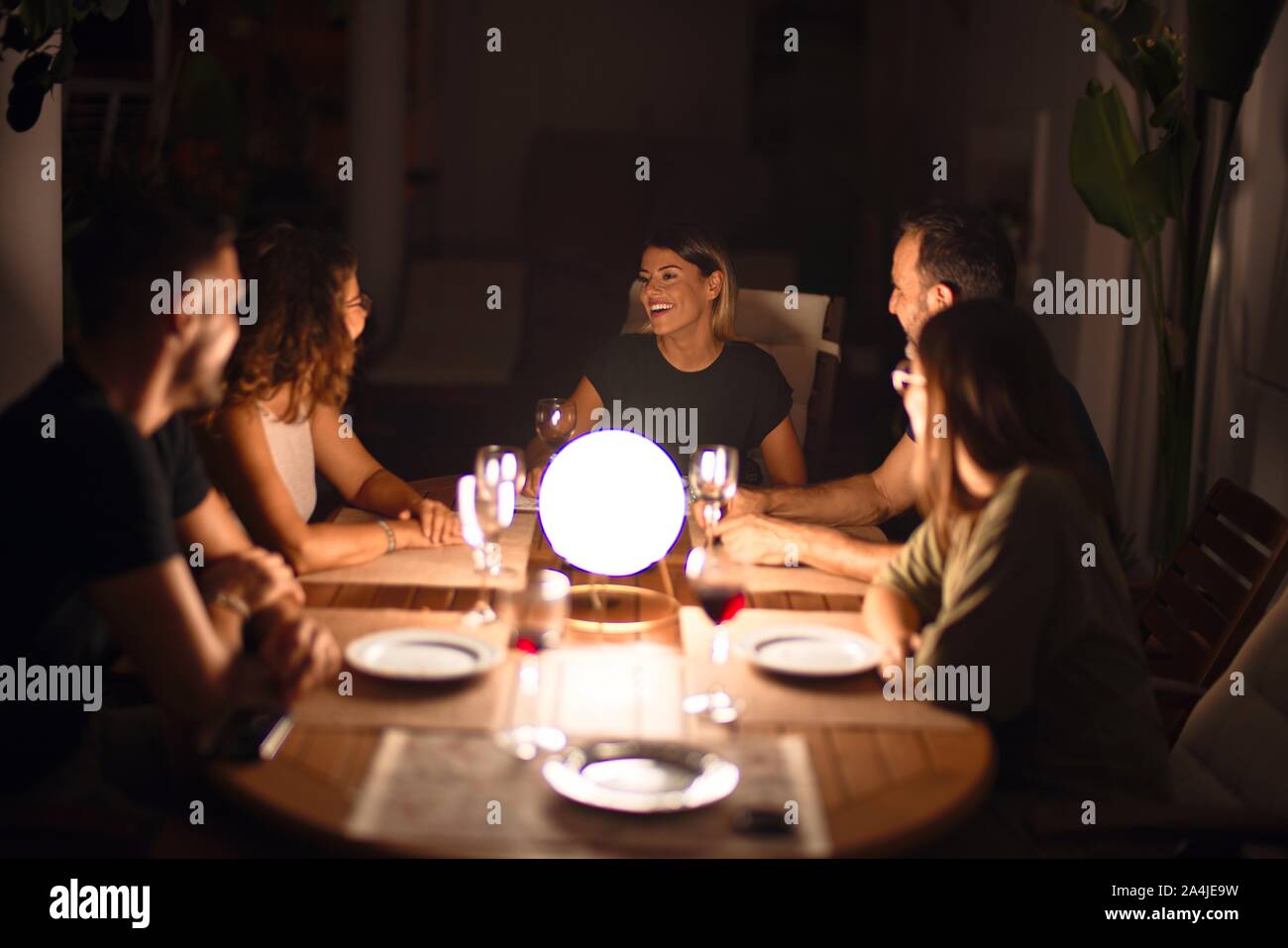 Beautiful family on dinner talking and smiling at terrace Stock Photo ...