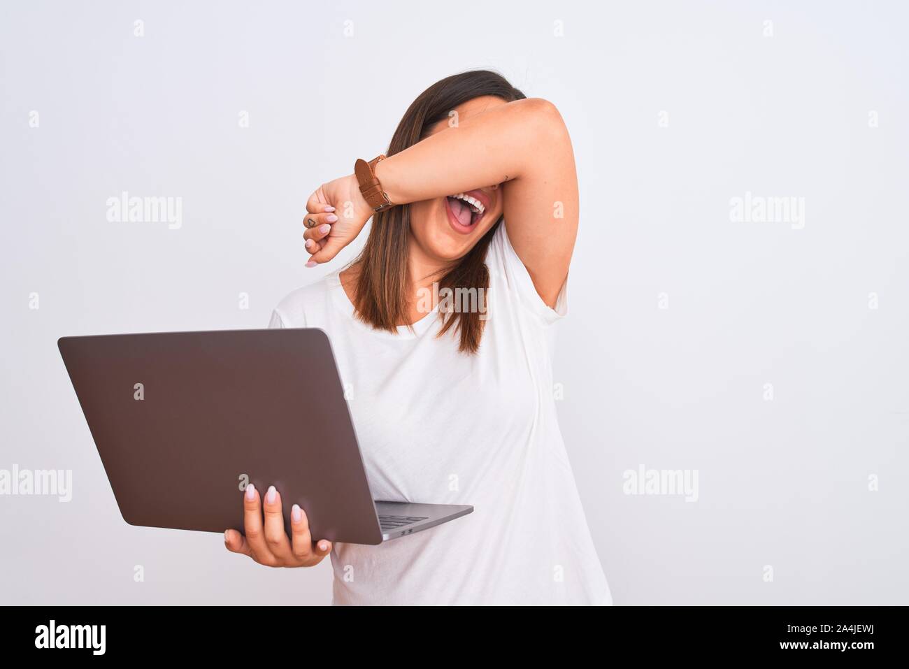 Beautiful young woman working using computer laptop over white ...
