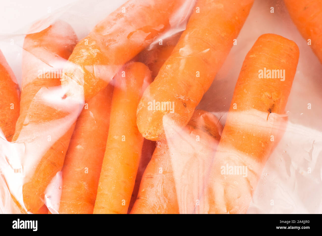 Bunch of organic Carrots packaged in plastic bag Stock Photo - Alamy