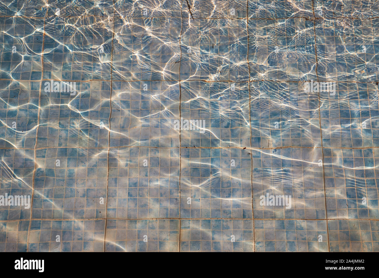 Old faded tiles in a dirty pool as a background Stock Photo - Alamy